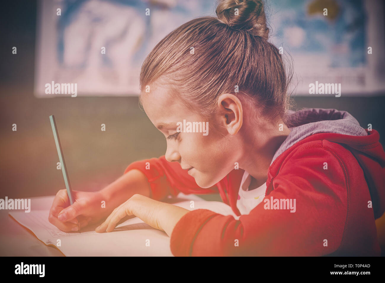 Girl writing in her notebook Stock Photo - Alamy