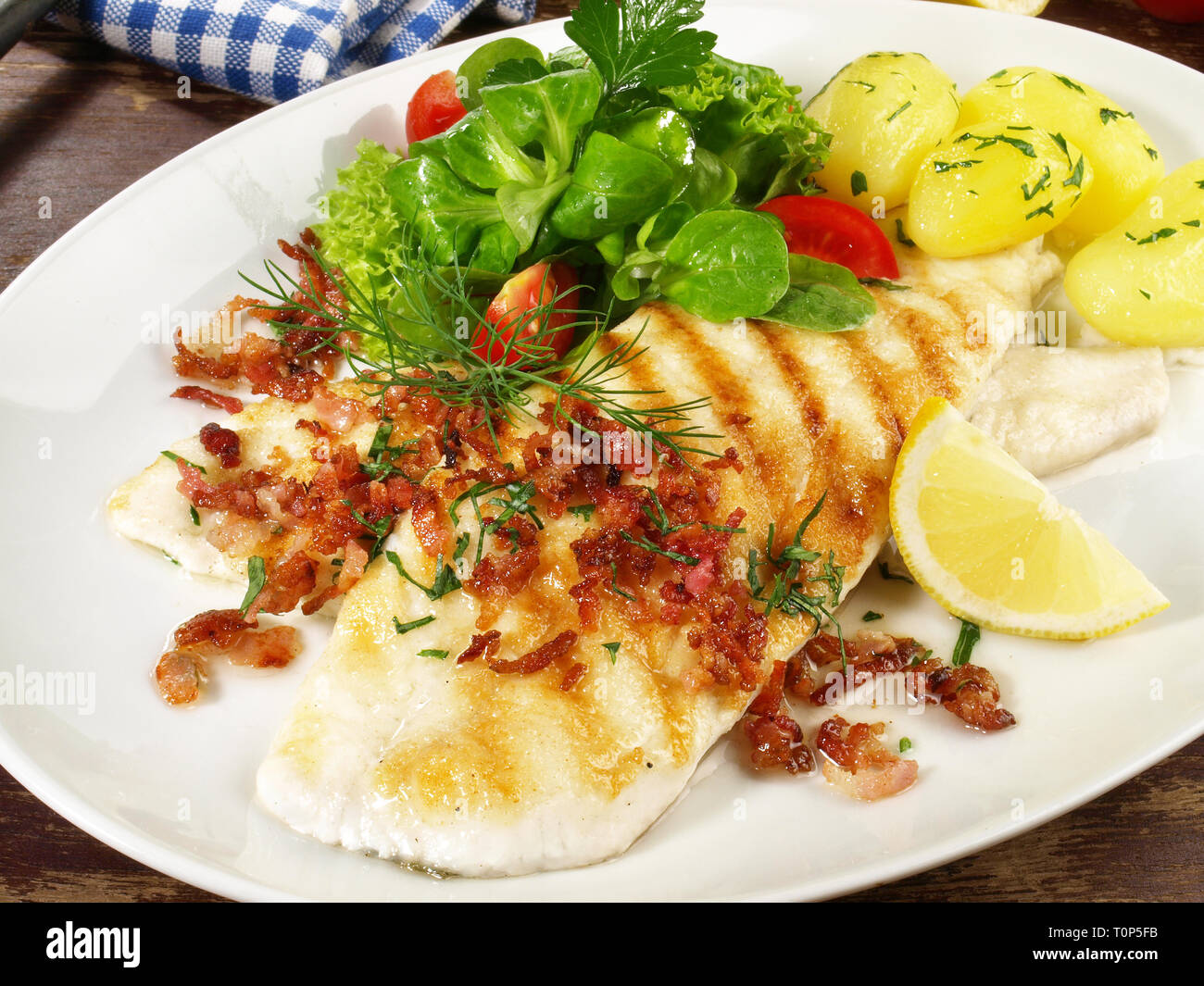 Grilled Plaice Fish Fillet with Bacon Stock Photo - Alamy