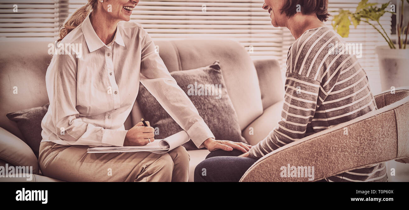 Smiling patient discussing psychologist hi-res stock photography and ...