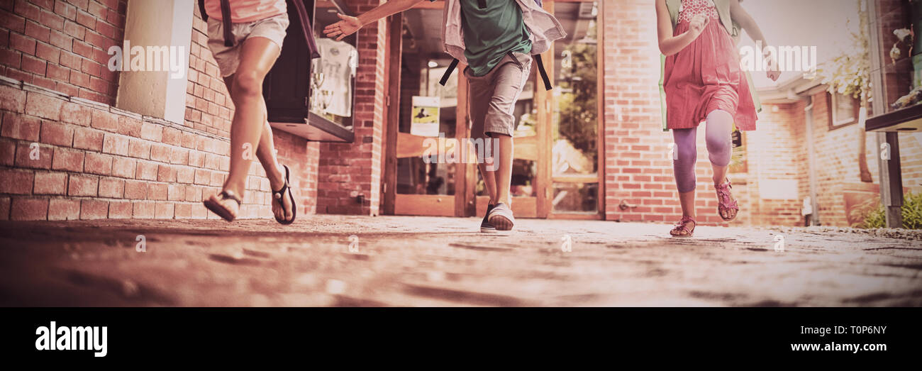 Kids running in school corridor Stock Photo - Alamy