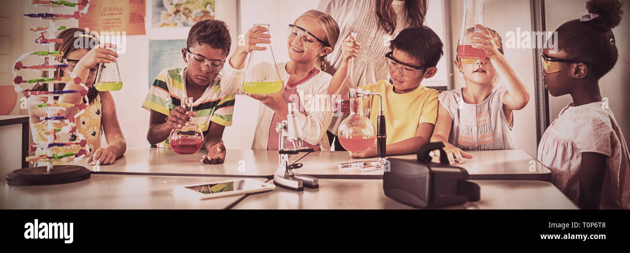 Smiling children doing science project Stock Photo - Alamy Smiling children doing science project Stock Photo - Alamy