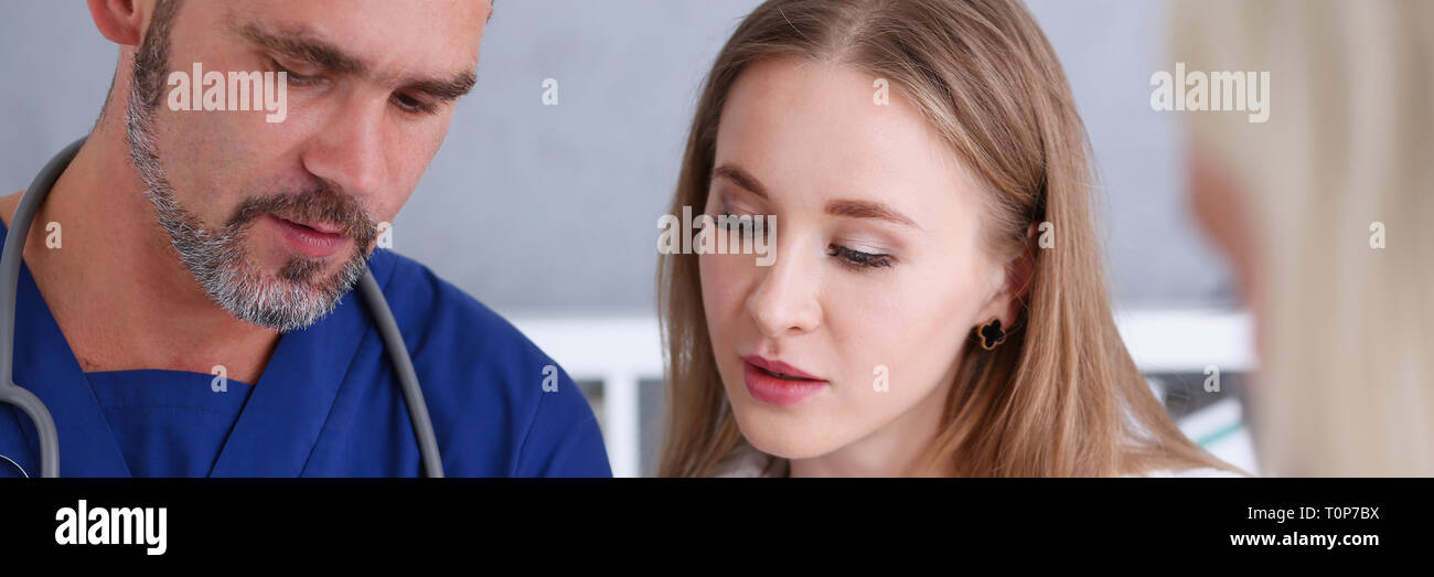 Concerned handsome doctor communicate with patient Stock Photo - Alamy
