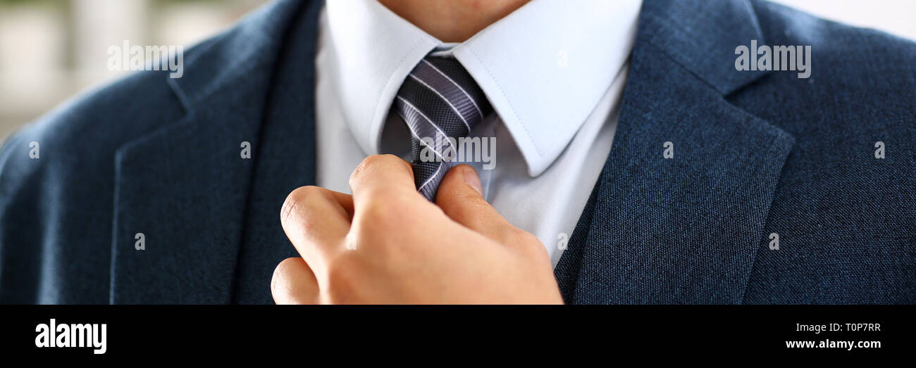 Male arm in blue suit set tie closeup Stock Photo - Alamy