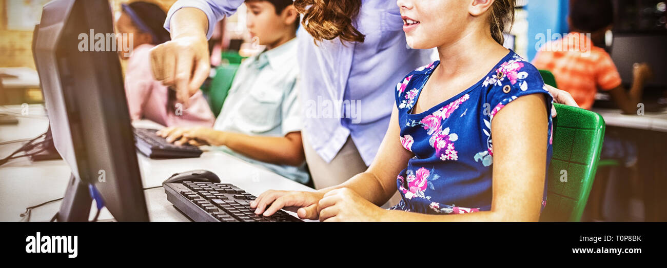Children looking their computer Stock Photo - Alamy