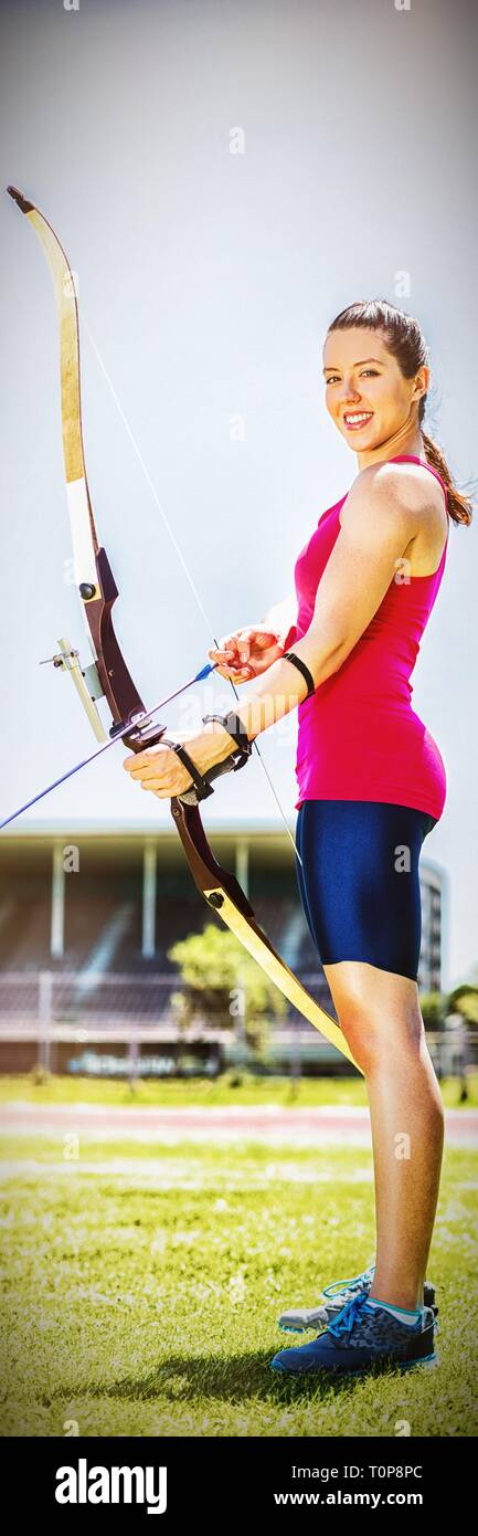 Female athlete practicing archery Stock Photo - Alamy