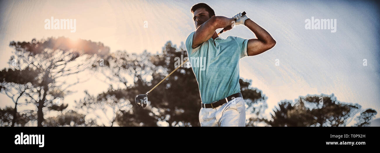 Full length of handsome golfer man taking shot Stock Photo - Alamy