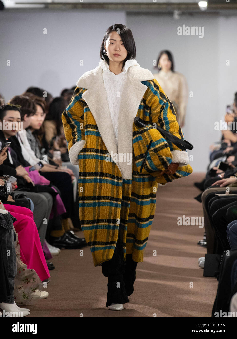 Seoul, South Korea. 21st Mar, 2019. A model presents a creation of ...