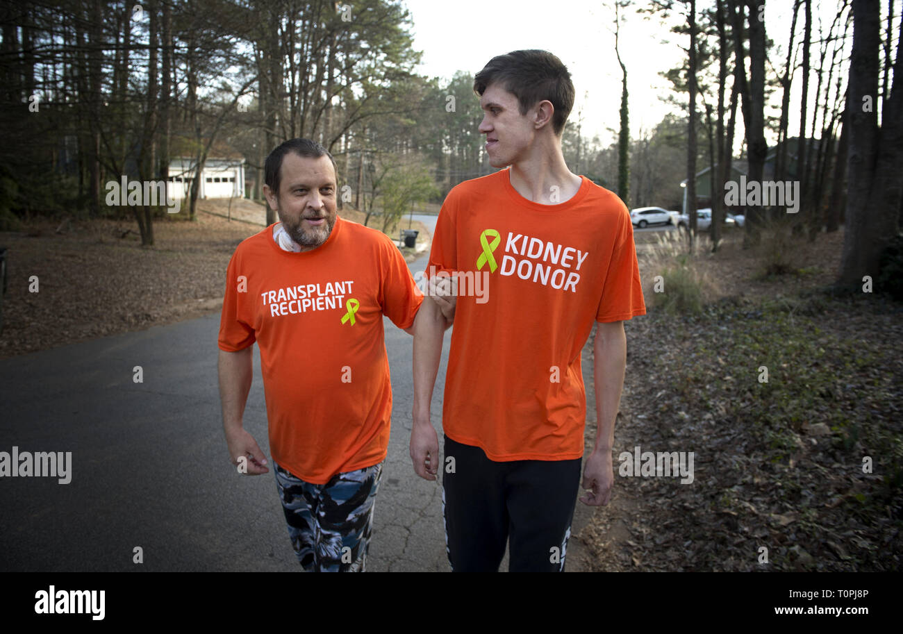 Kennesaw, GA, USA. 5th Feb, 2019. Neil Ketchledge, 54, leans on his son ...