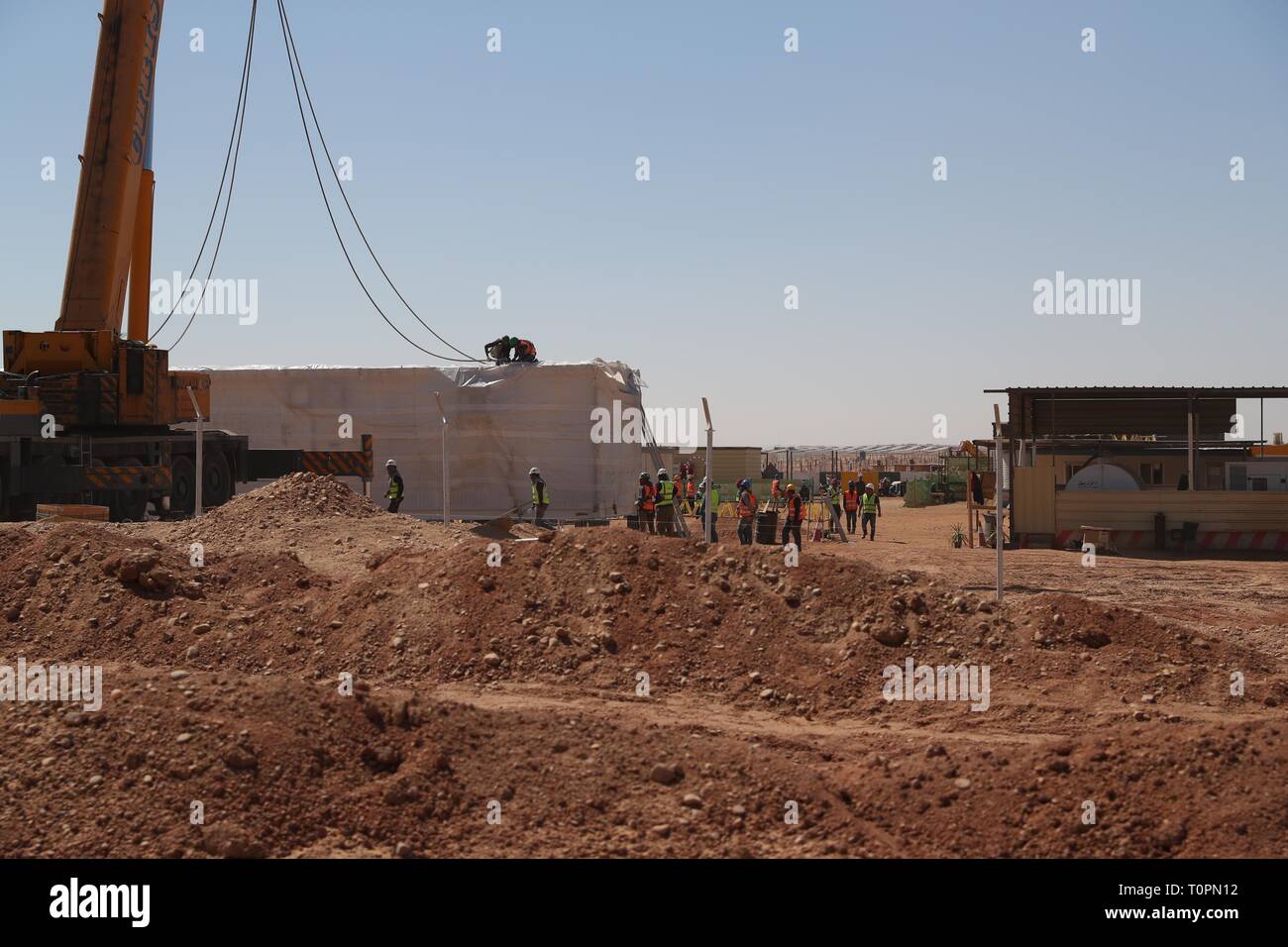 Aswan. 18th Mar, 2019. People work in a TBEA solar power station in ...