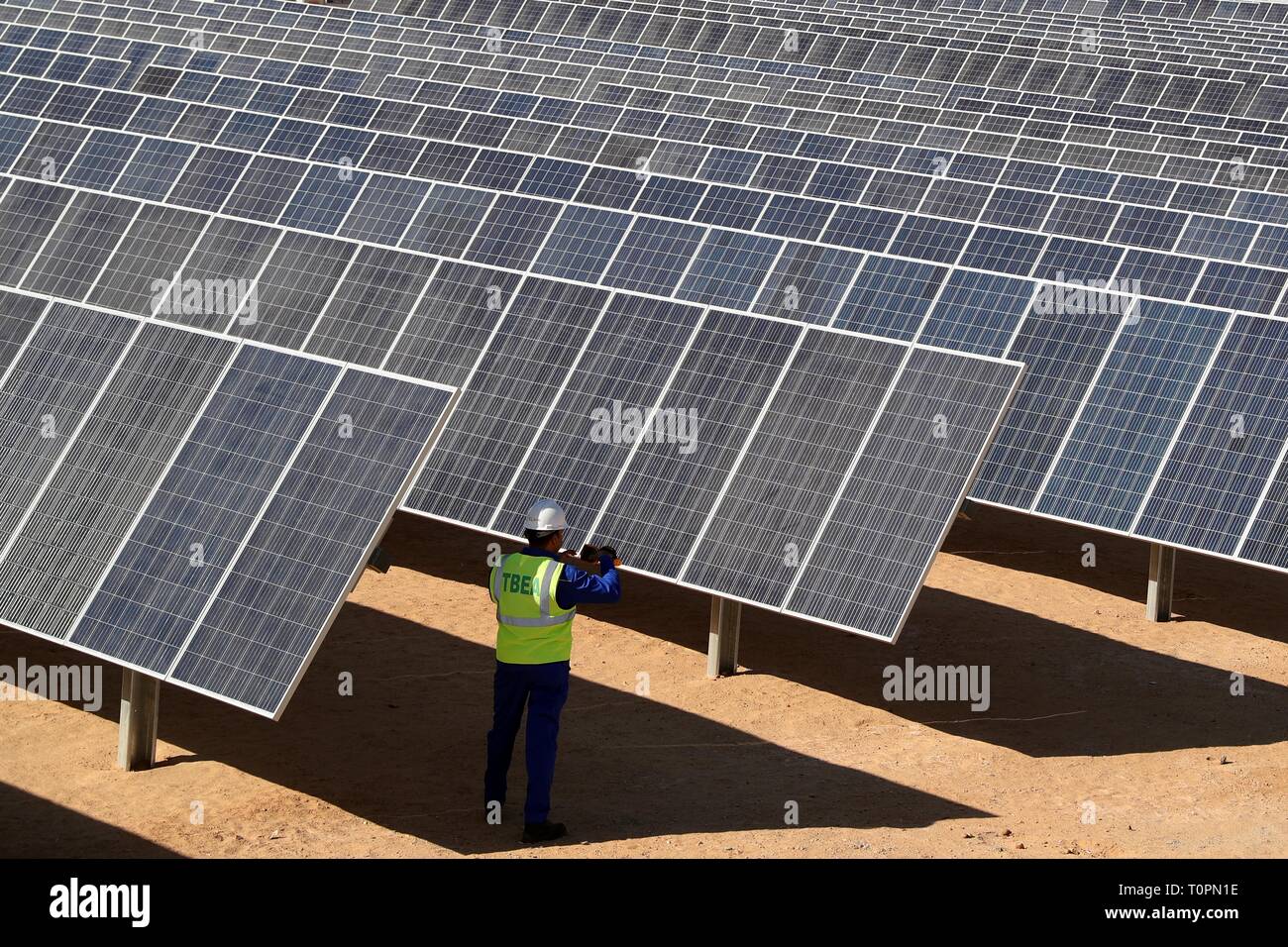 Aswan. 18th Mar, 2019. A man works in a TBEA solar power station in ...