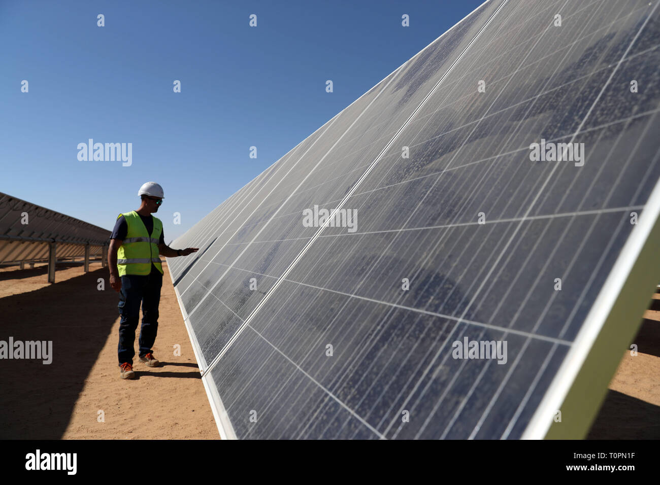 Aswan. 18th Mar, 2019. A man works in a TBEA solar power station in ...