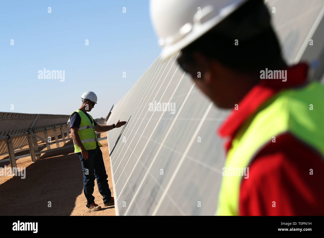 Aswan. 18th Mar, 2019. People work in a TBEA solar power station in ...