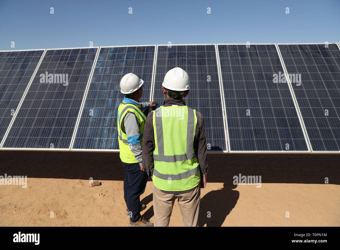Aswan. 18th Mar, 2019. People work in a TBEA solar power station in ...