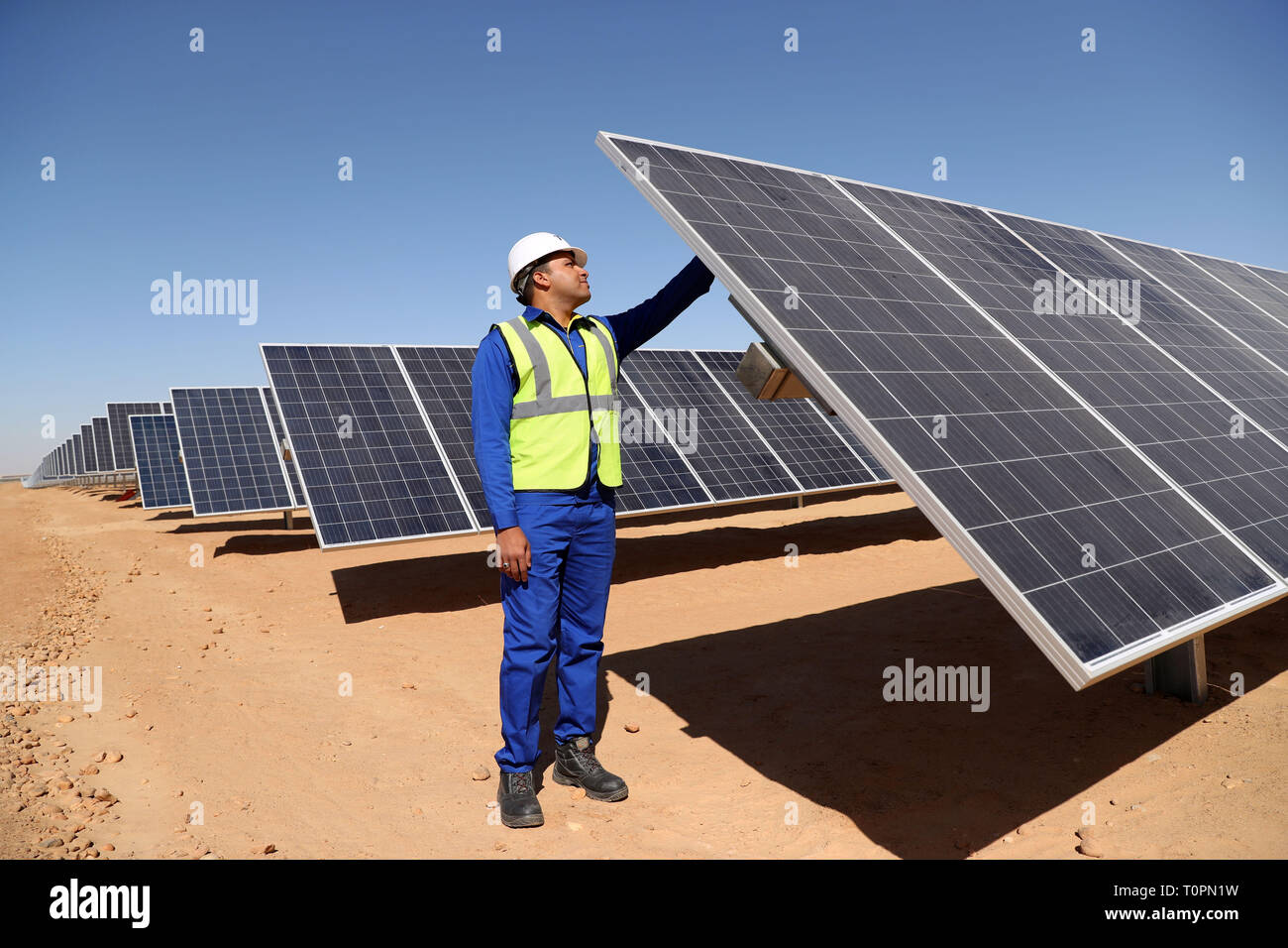 Aswan. 18th Mar, 2019. A man works in a TBEA solar power station in ...