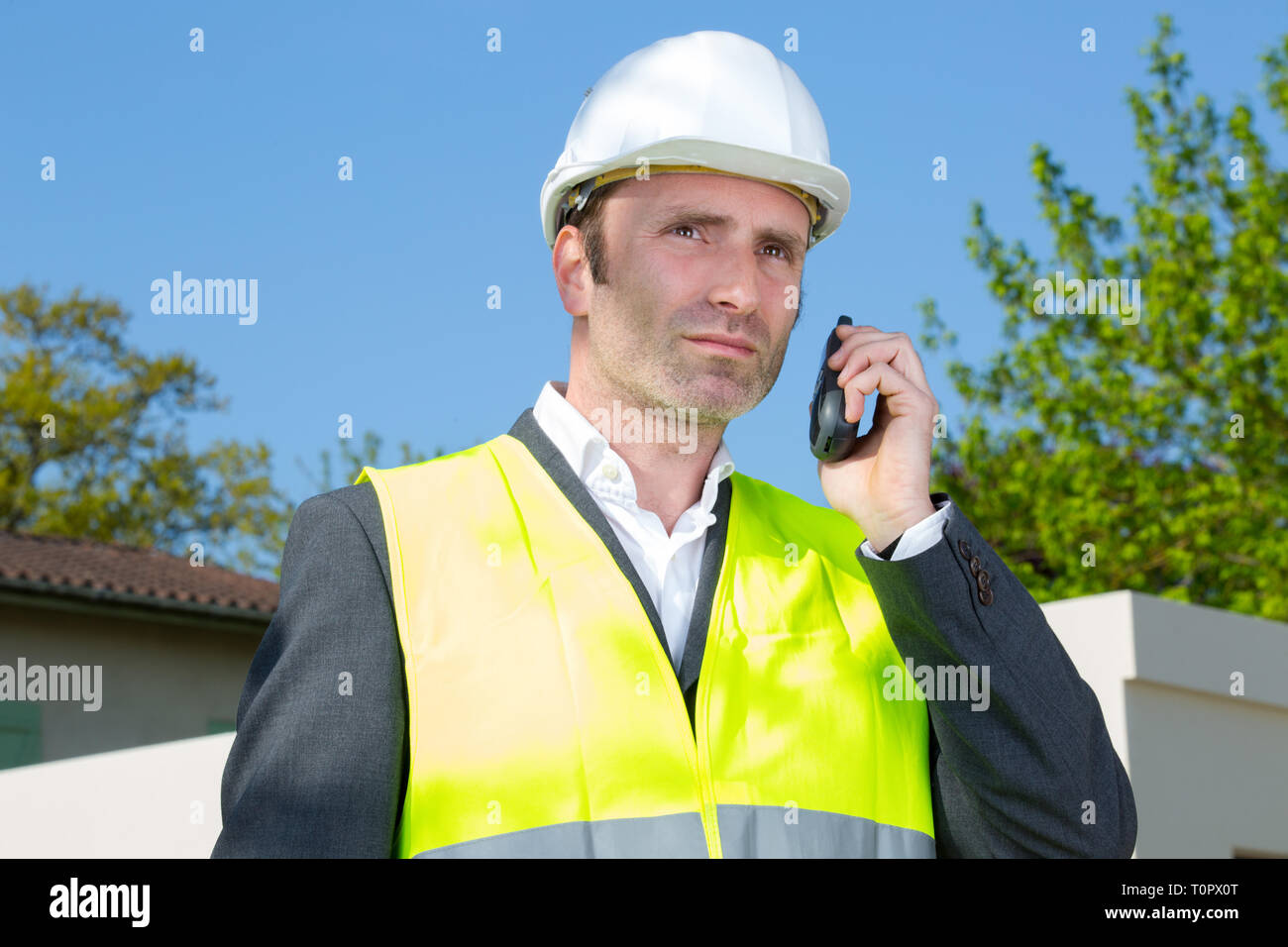 engineer is make call with a walkie talkie outdoors Stock Photo - Alamy