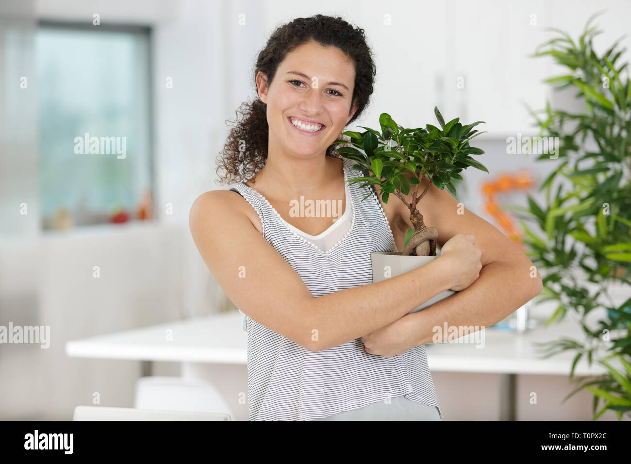 woman hugging plant Stock Photo - Alamy