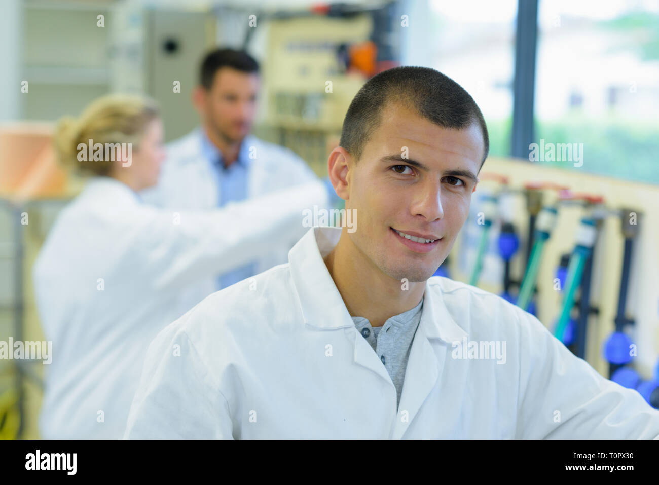 Young researcher wearing lab coat hi-res stock photography and images ...
