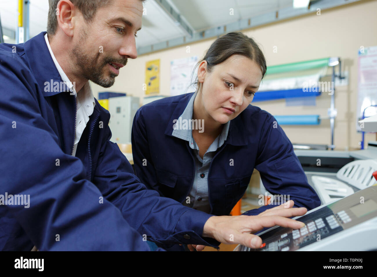 woman and man in garage Stock Photo - Alamy