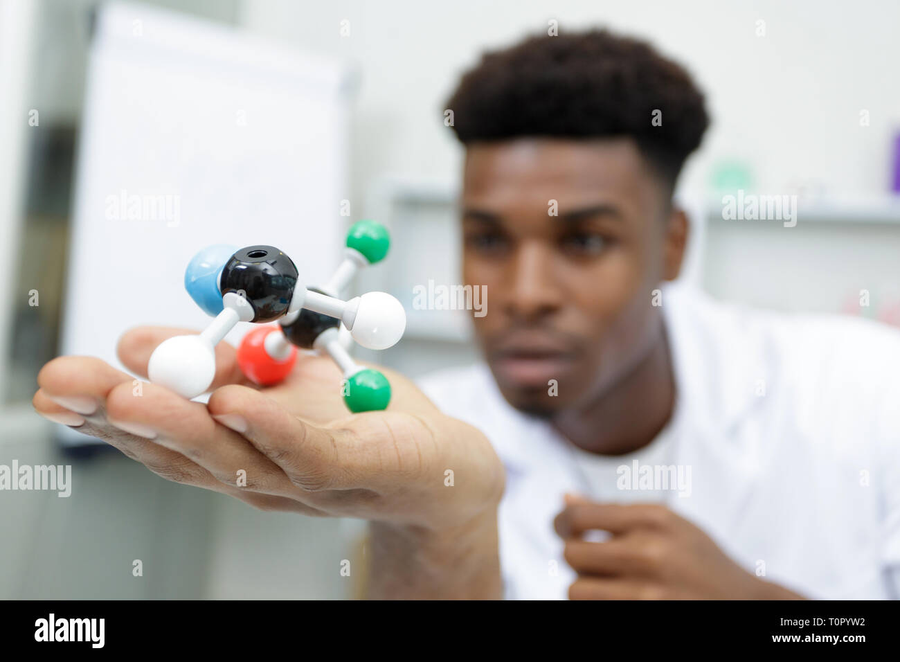 man scientist in eyeglasses holding molecular model in lab Stock Photo ...