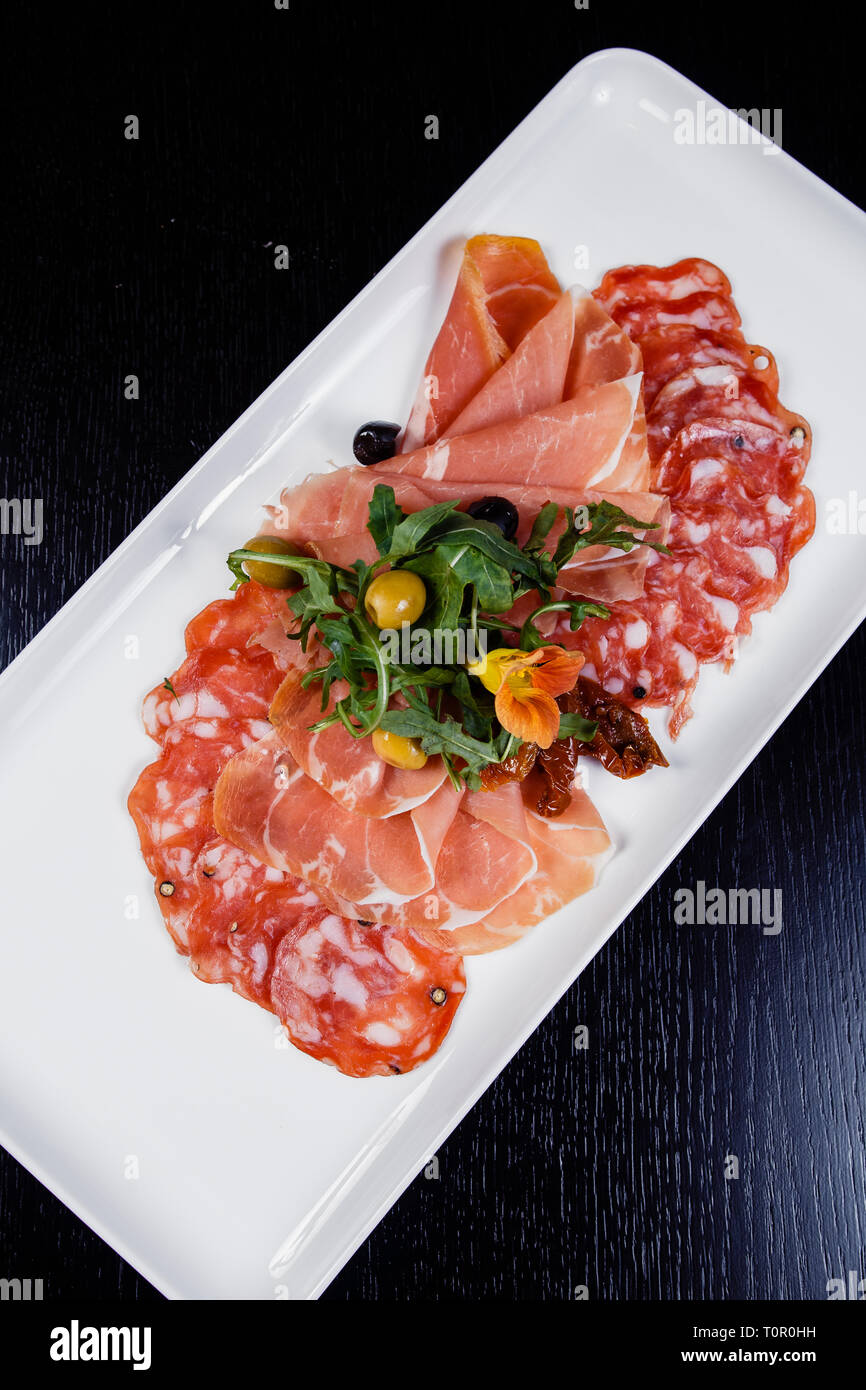 Italian salumi meat platter - prosciutto ham, bresaola, pancetta ...