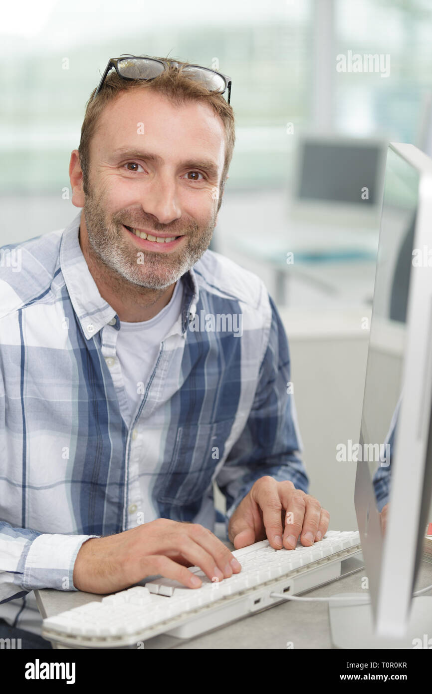 employee with eyeglasses using computer at office Stock Photo - Alamy