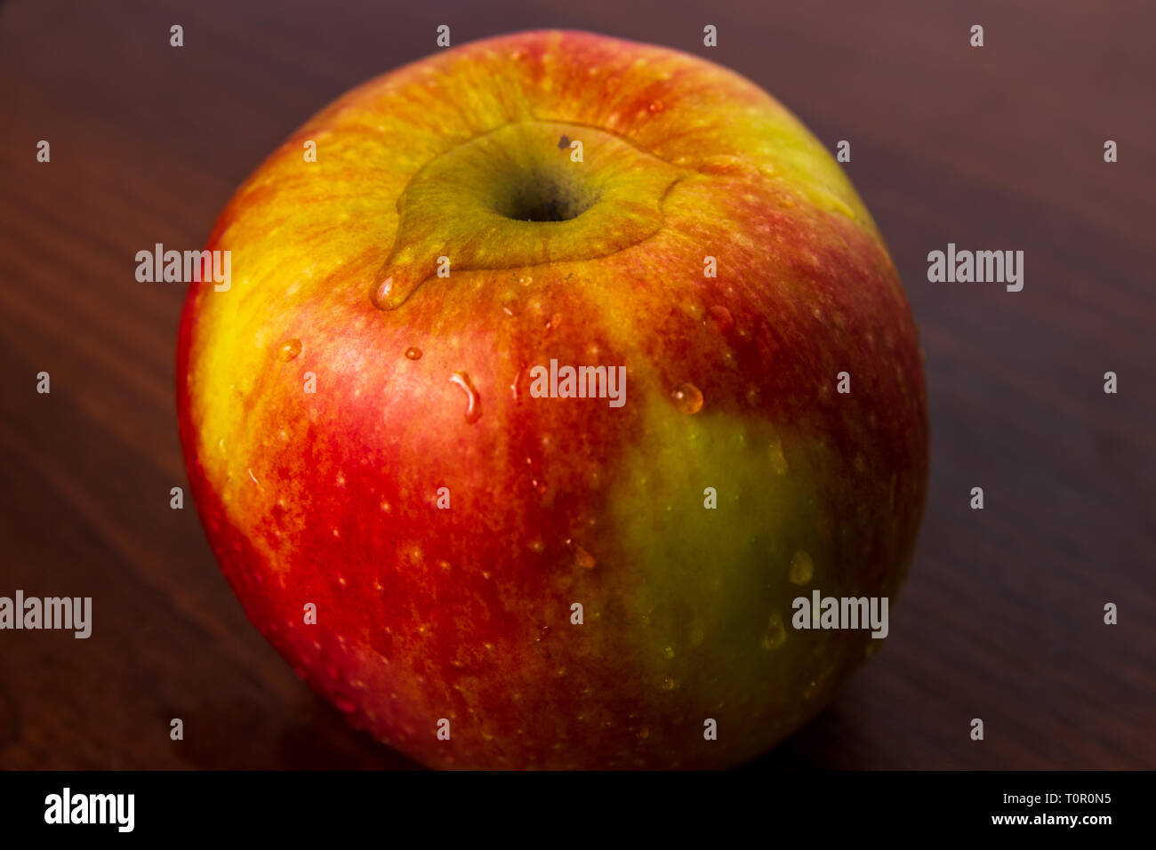Healthy organic apple isolated on a dark wood background Stock Photo ...