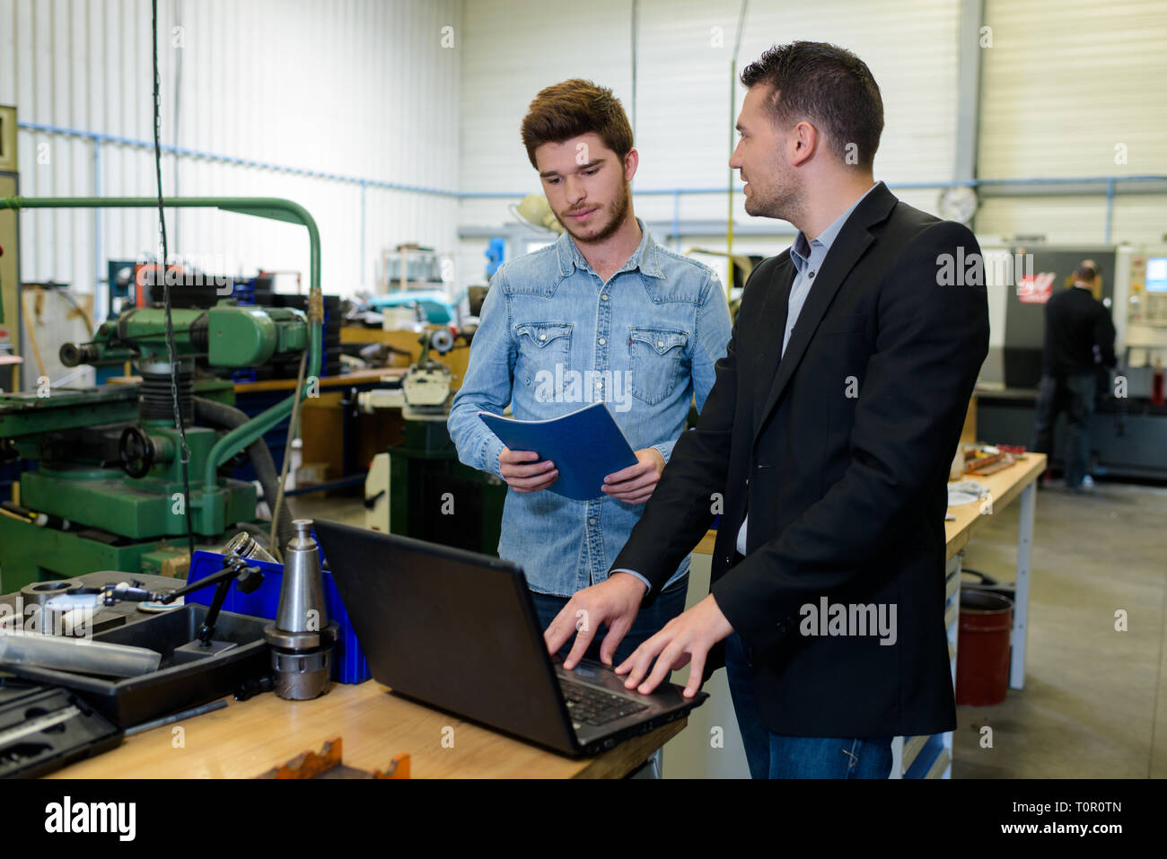 fixing an engine problem Stock Photo - Alamy