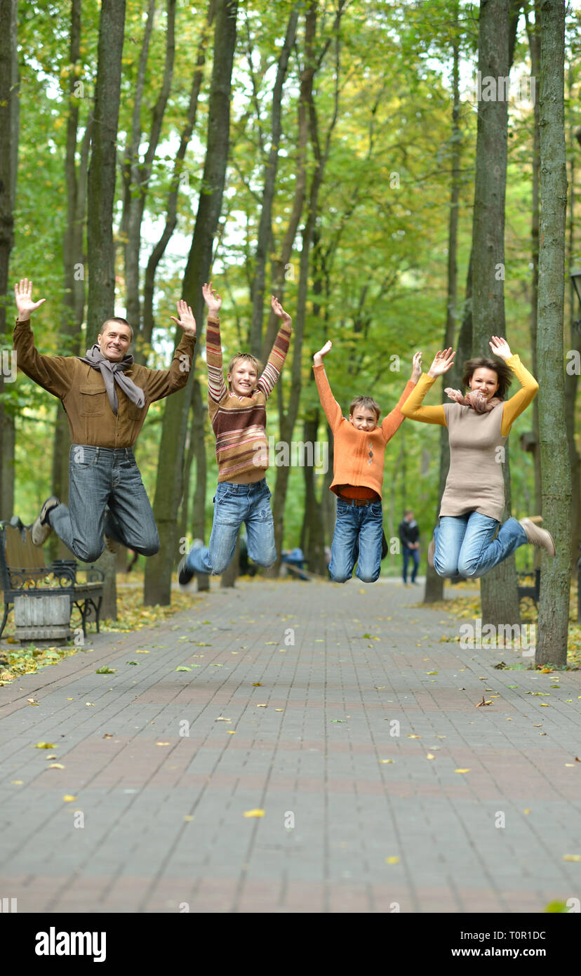 Family jumping together park hi-res stock photography and images - Alamy