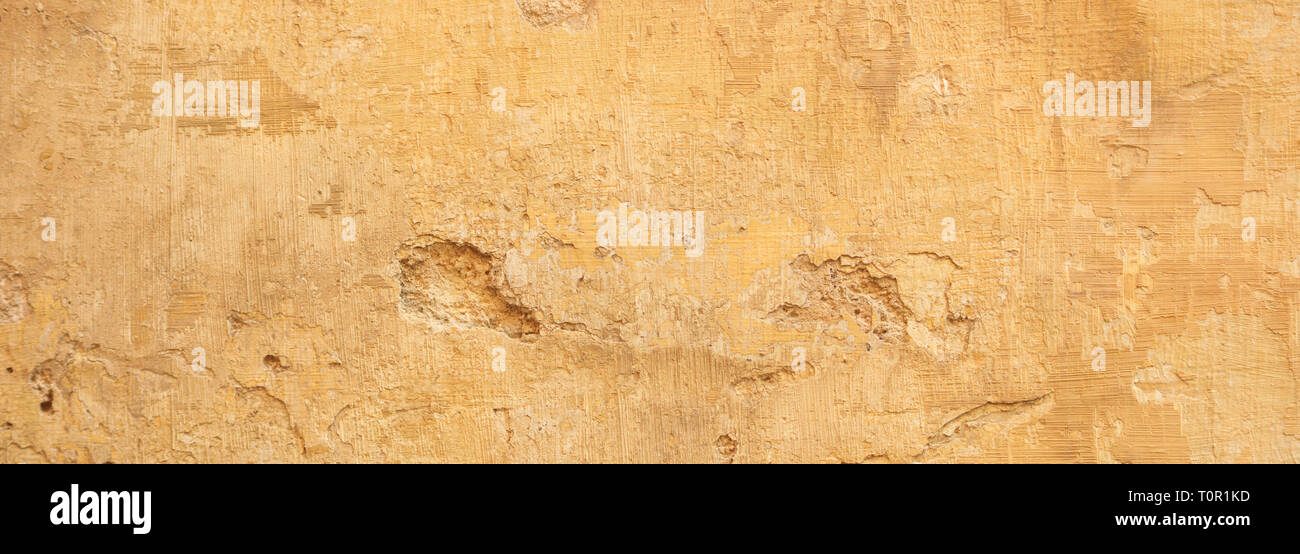 Beige yellow color, painted and faded wall texture grunge background ...