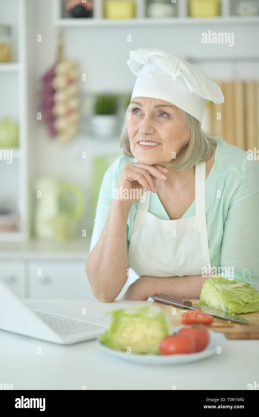 Portrait of senior woman chef portrait at kitchen Stock Photo - Alamy