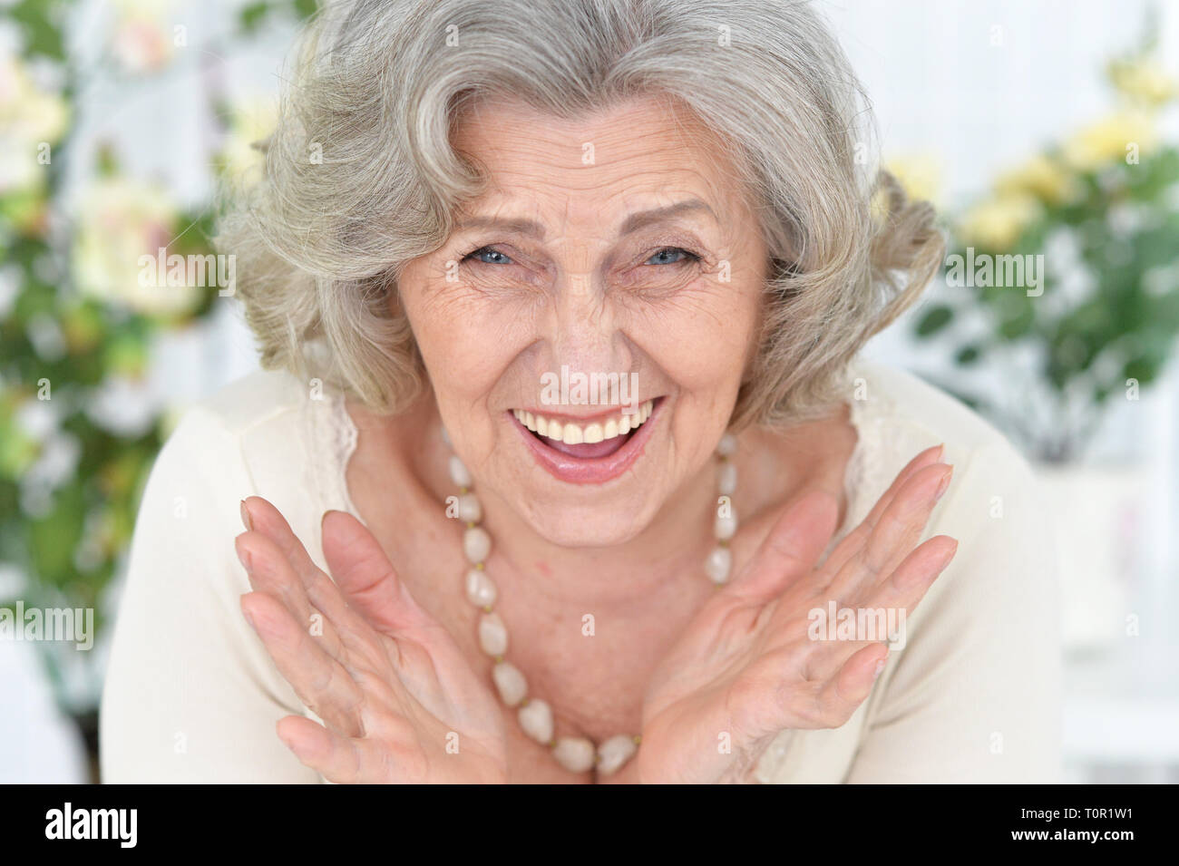 Close-up portrait of happy senior woman portrait Stock Photo - Alamy
