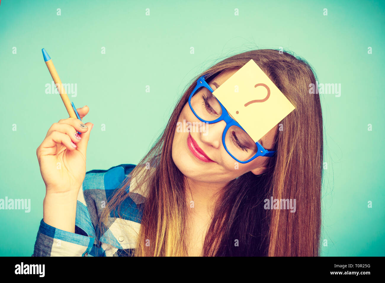Thinking woman with big nerdy eyeglasses and question mark on forehead ...