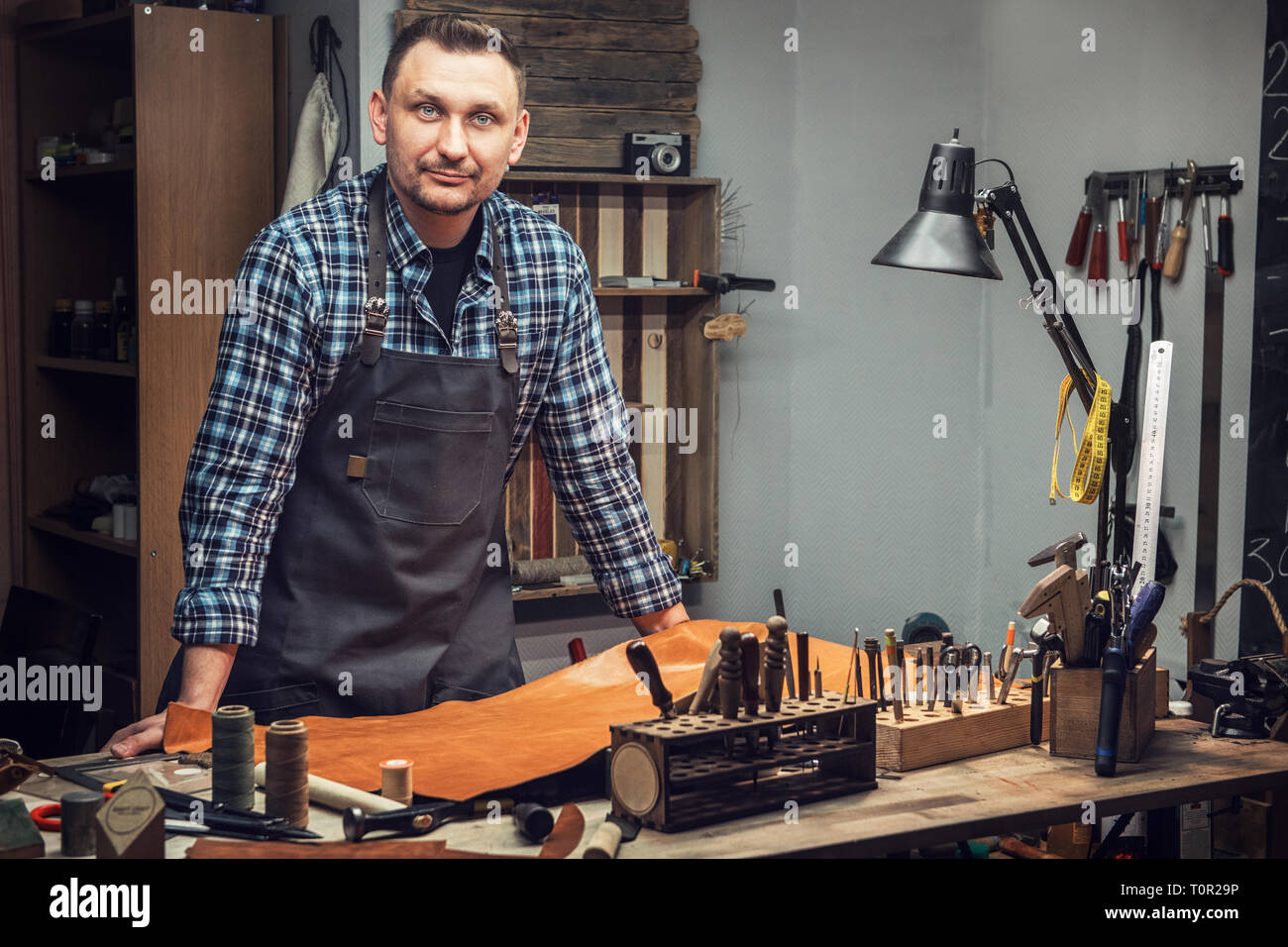 Concept of handmade craft production of leather goods Stock Photo - Alamy