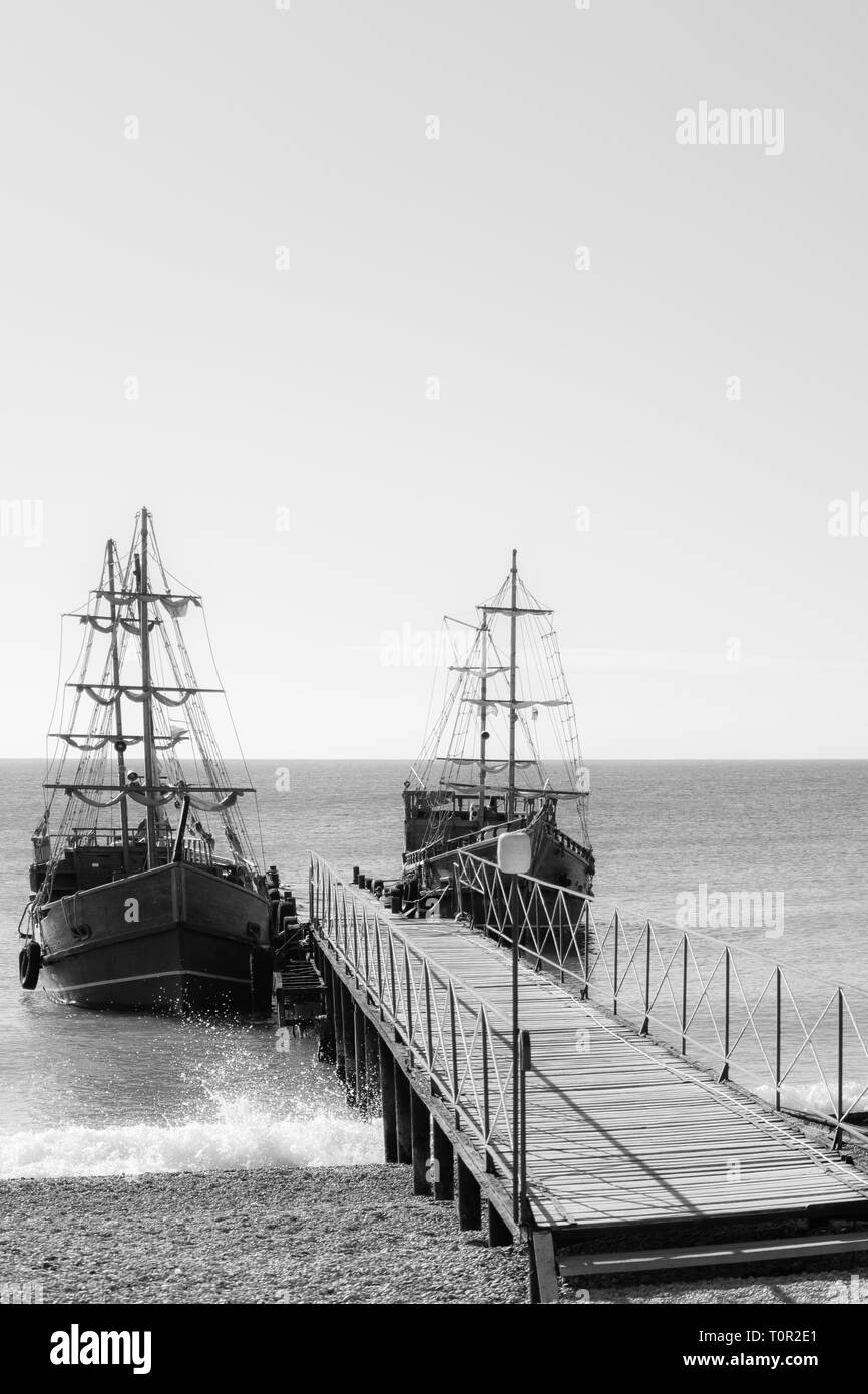 Two sailing ships coast Black and White Stock Photos & Images - Alamy