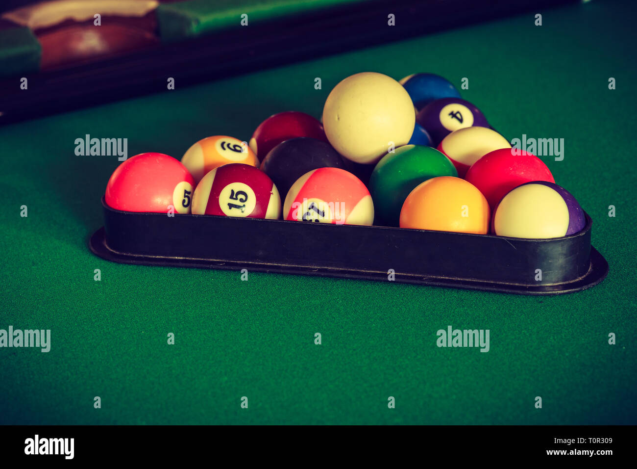 Billiard cue balls on green table. Pool game Stock Photo - Alamy