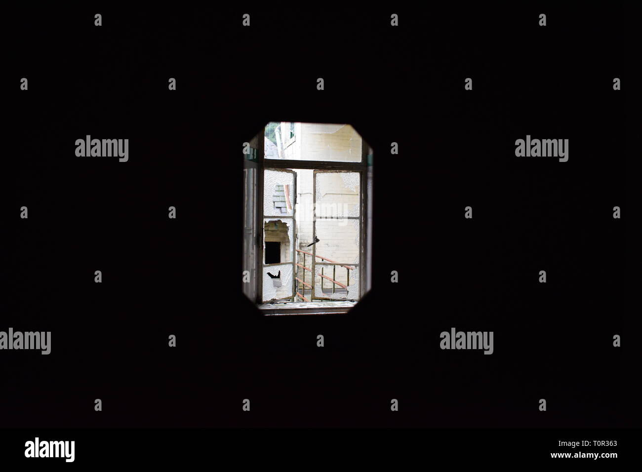 Looking through peephole hi-res stock photography and images - Alamy