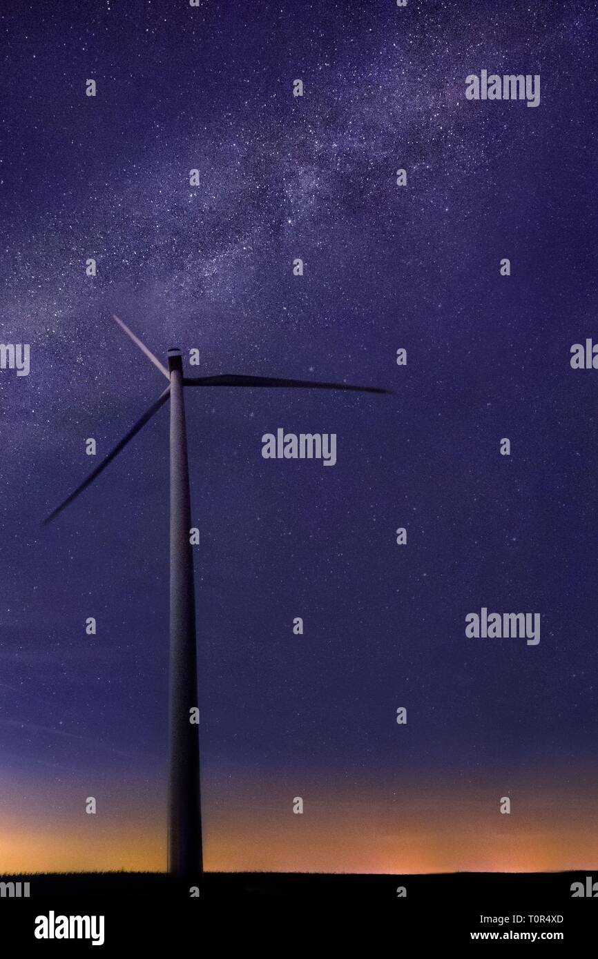 One wind turbine with beautiful milky way in background with bright ...