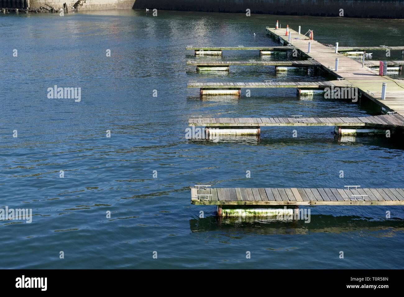 Pontoon wooden jetty pier for boat mooring marina at sea Stock Photo ...