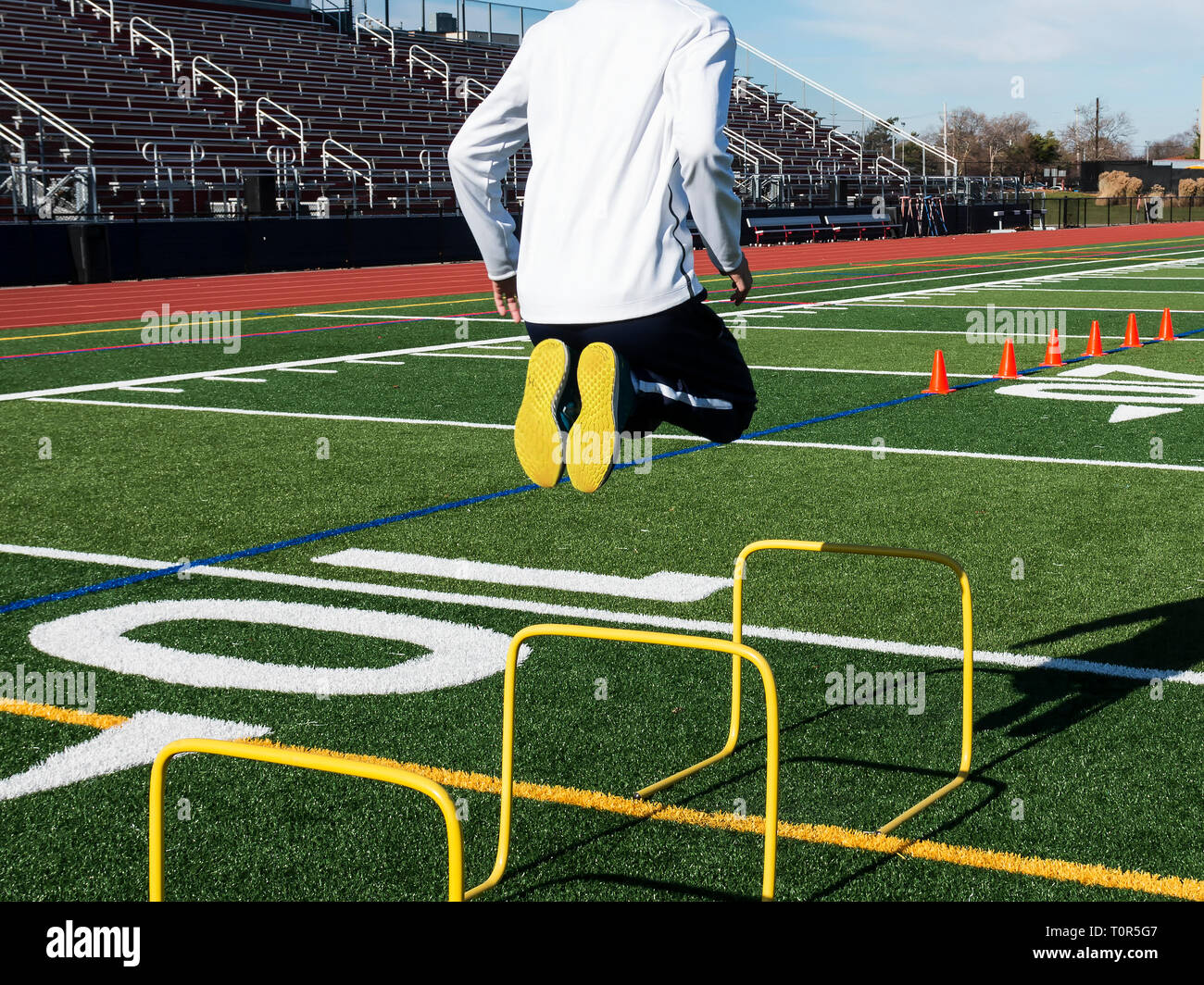Athlete jumping over hurdle hi-res stock photography and images - Alamy