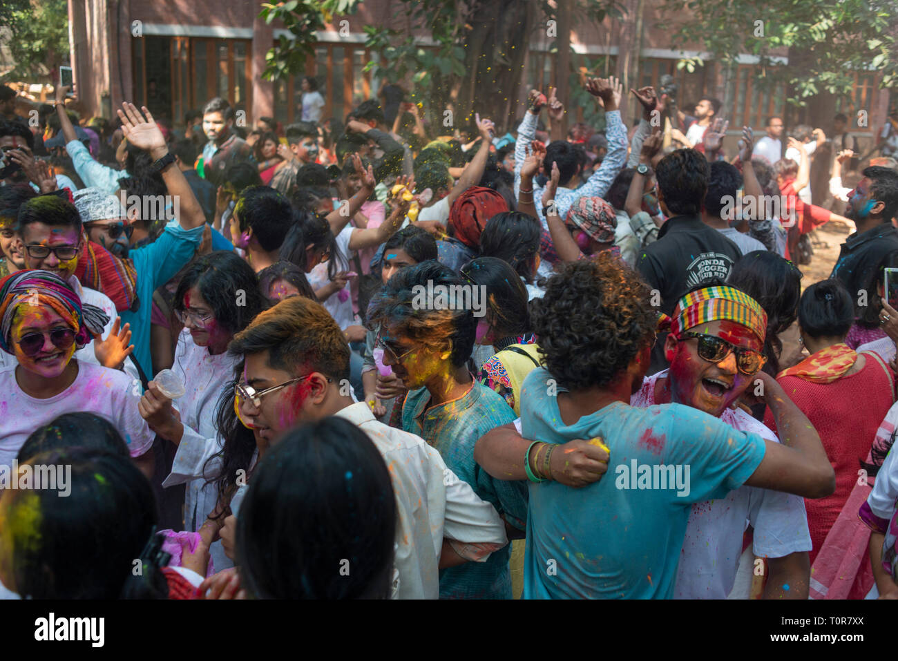 People seen dancing celebrating during the Holi festival. Holi known as ...