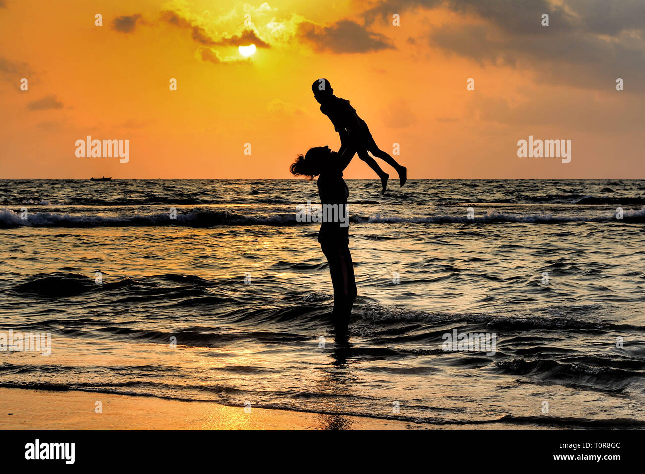 mother and son in the beach Stock Photo - Alamy