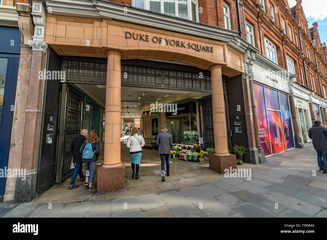 People walking through the entrance to Duke of York Square,Sloane ...