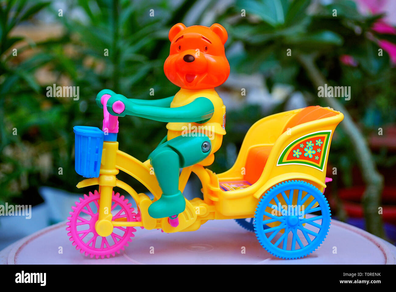 Trycycle of toy in green natural background.it's very colourful Stock ...