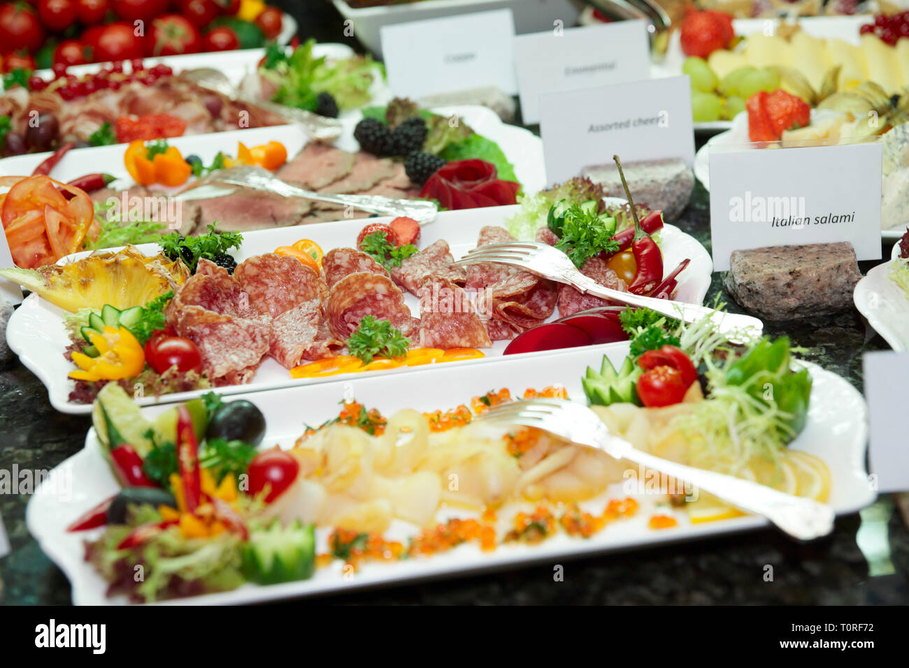 Meat, fish and fruits in expensive hotel restaurant Stock Photo - Alamy