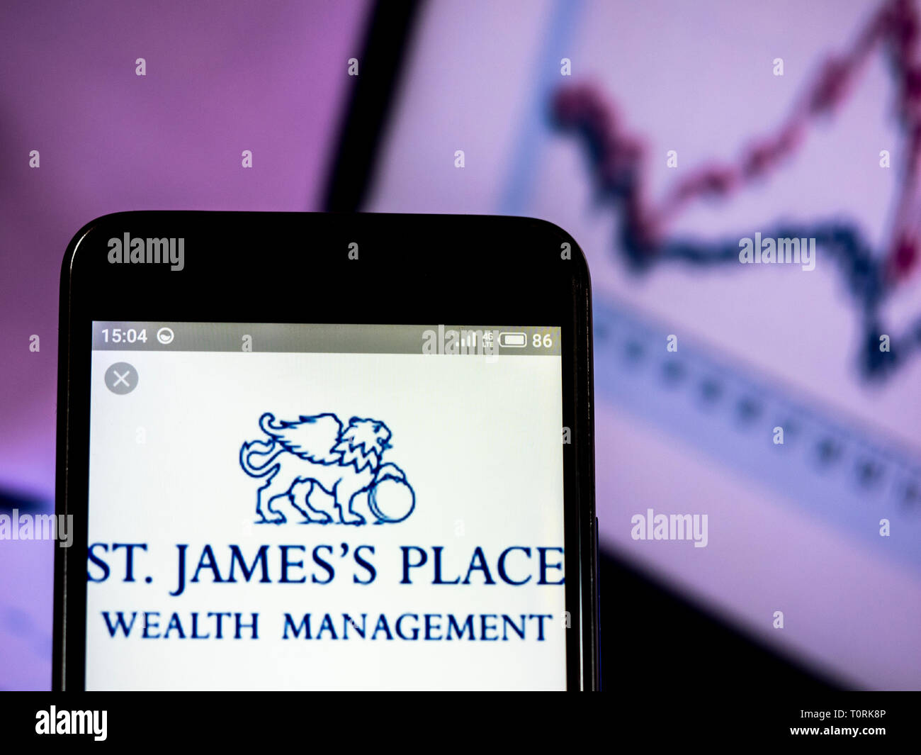 St. James's Place plc logo seen displayed on smart phone Stock Photo ...