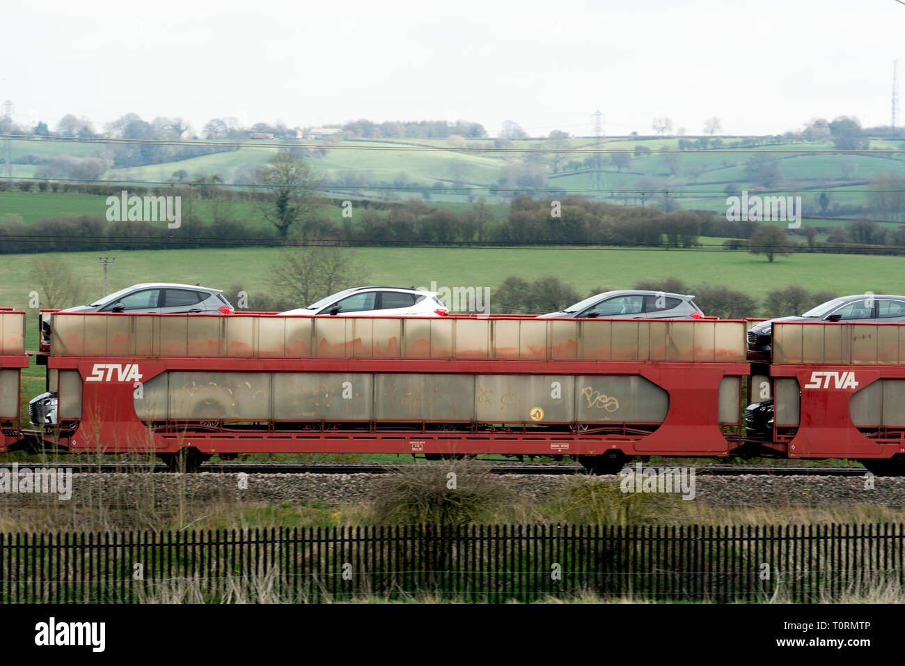 New Ford cars transported by rail, Northamptonshire, UK Stock Photo - Alamy