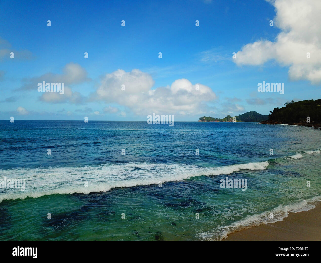 The Indian Ocean with coral reef on Seychelles island Mahe Stock Photo ...