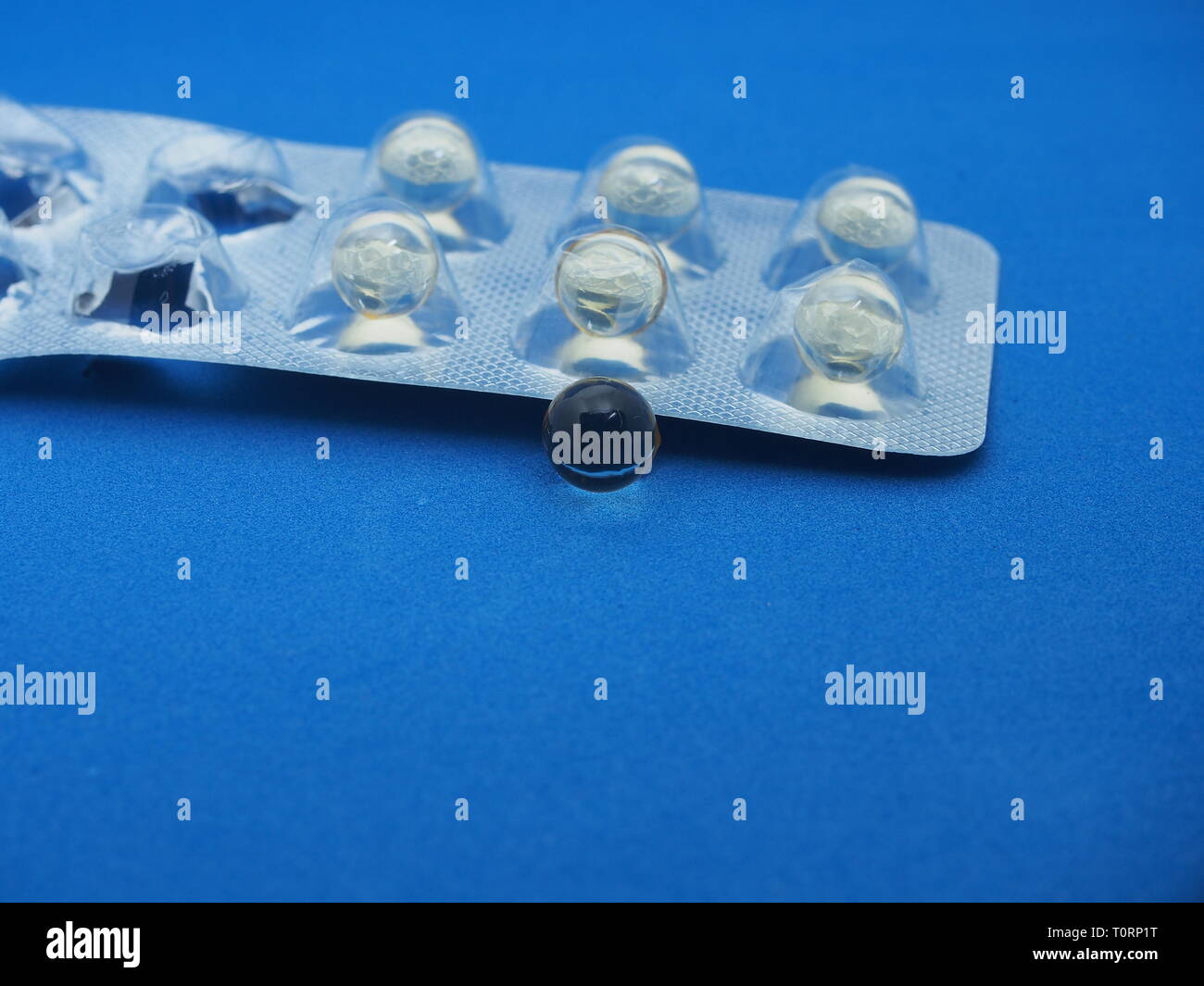 The drug is in a transparent capsule. Transparent plastic packaging ...