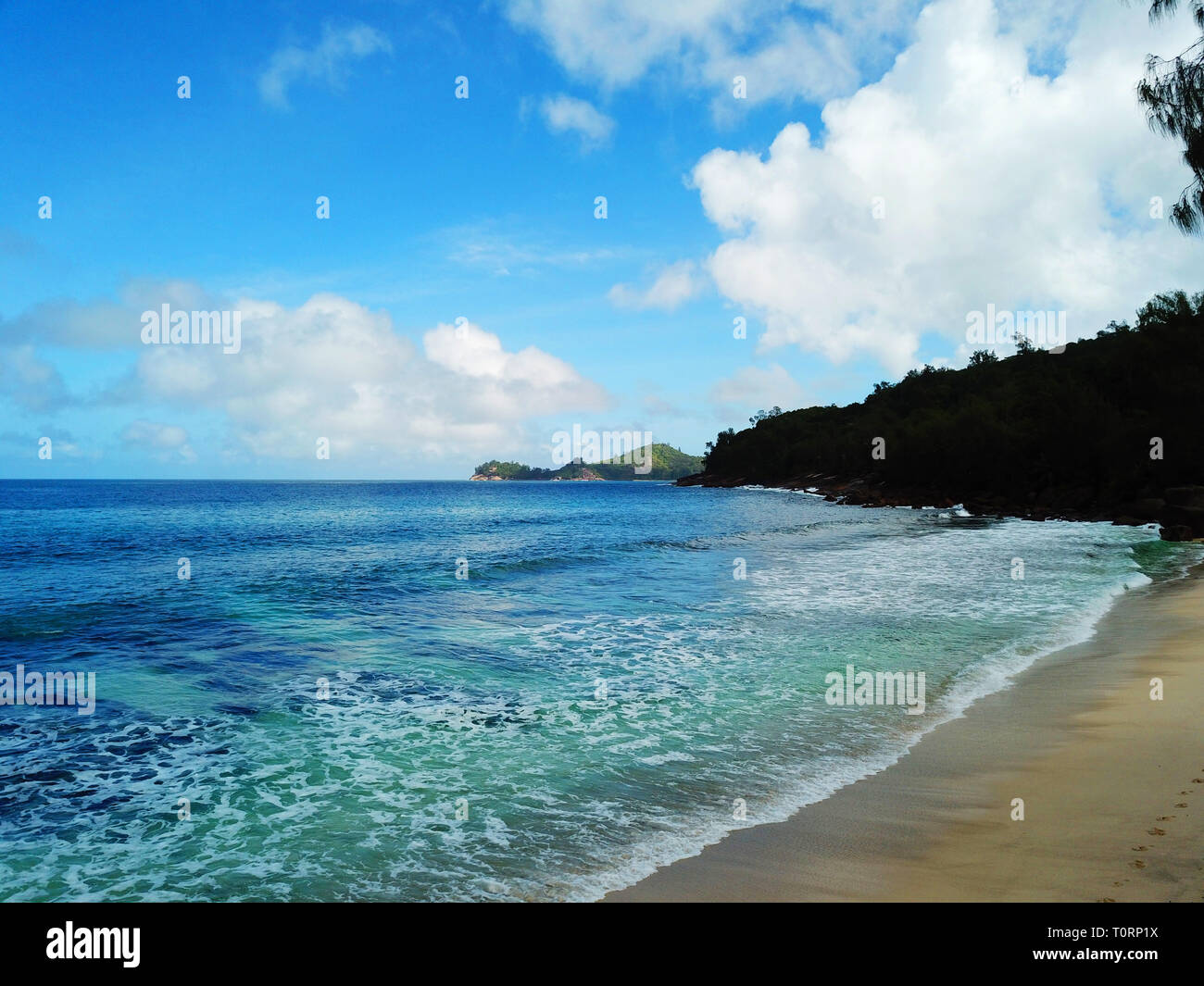 The Indian Ocean with coral reef on Seychelles island Mahe Stock Photo ...