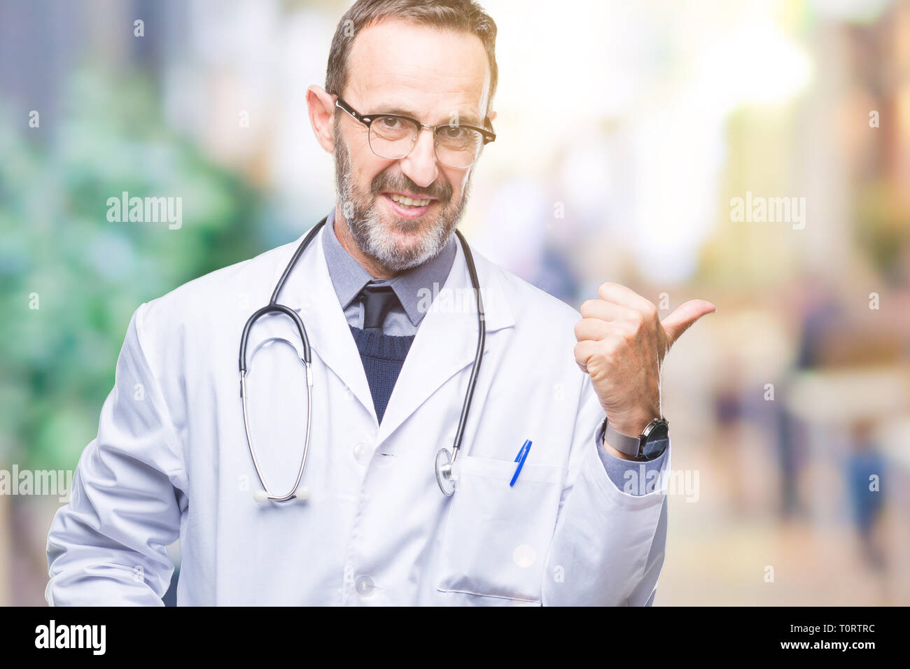 Middle age senior hoary doctor man wearing medical uniform isolated ...